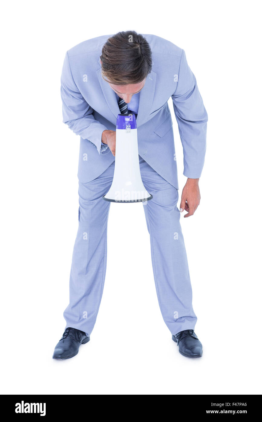 Businessman talking through megaphone Stock Photo - Alamy