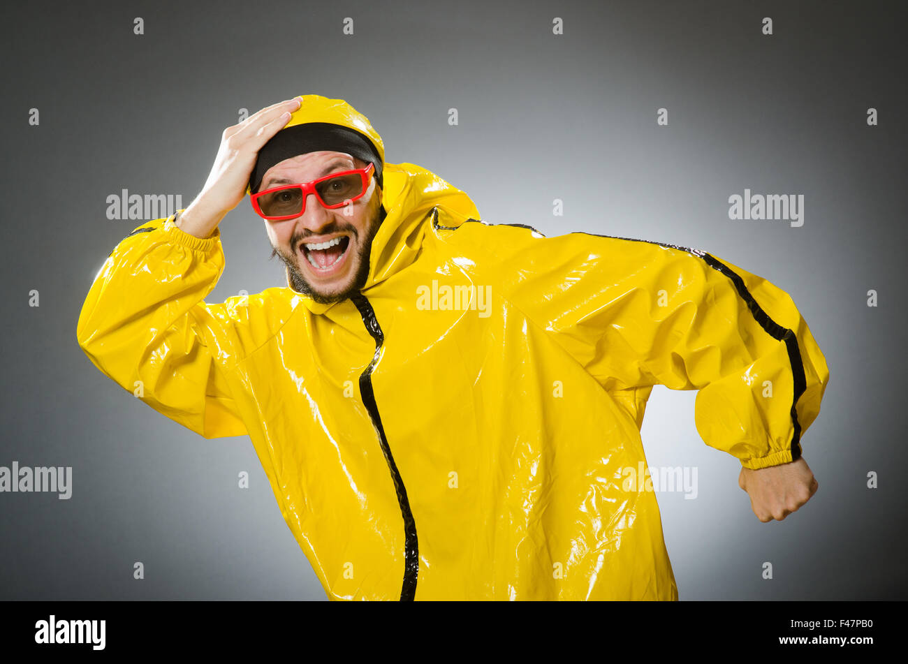 Funny man wearing yellow suit Stock Photo - Alamy