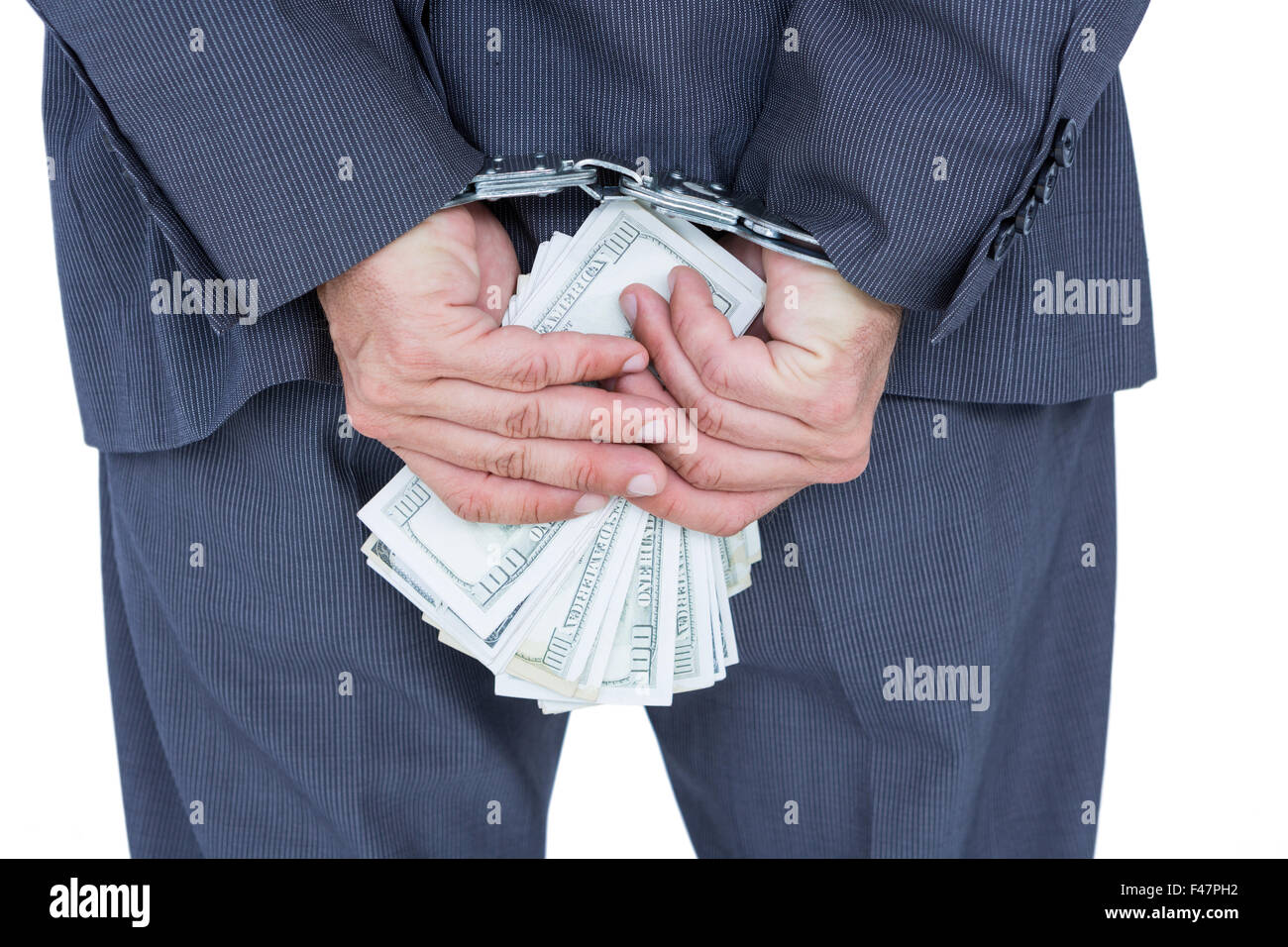 businessman in handcuffs holding bribe Stock Photo - Alamy
