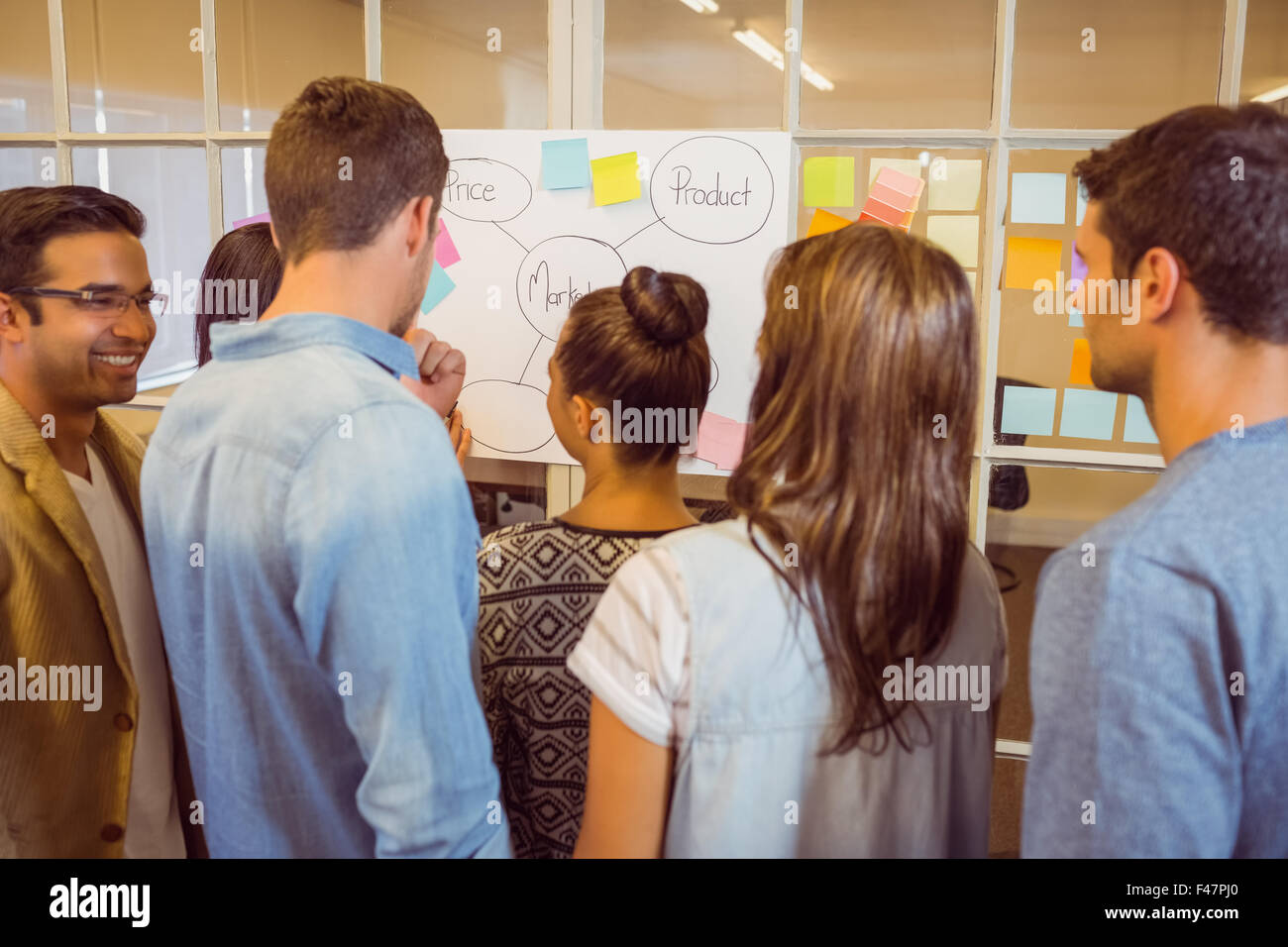 Rear view of business team in a meeting Stock Photo - Alamy