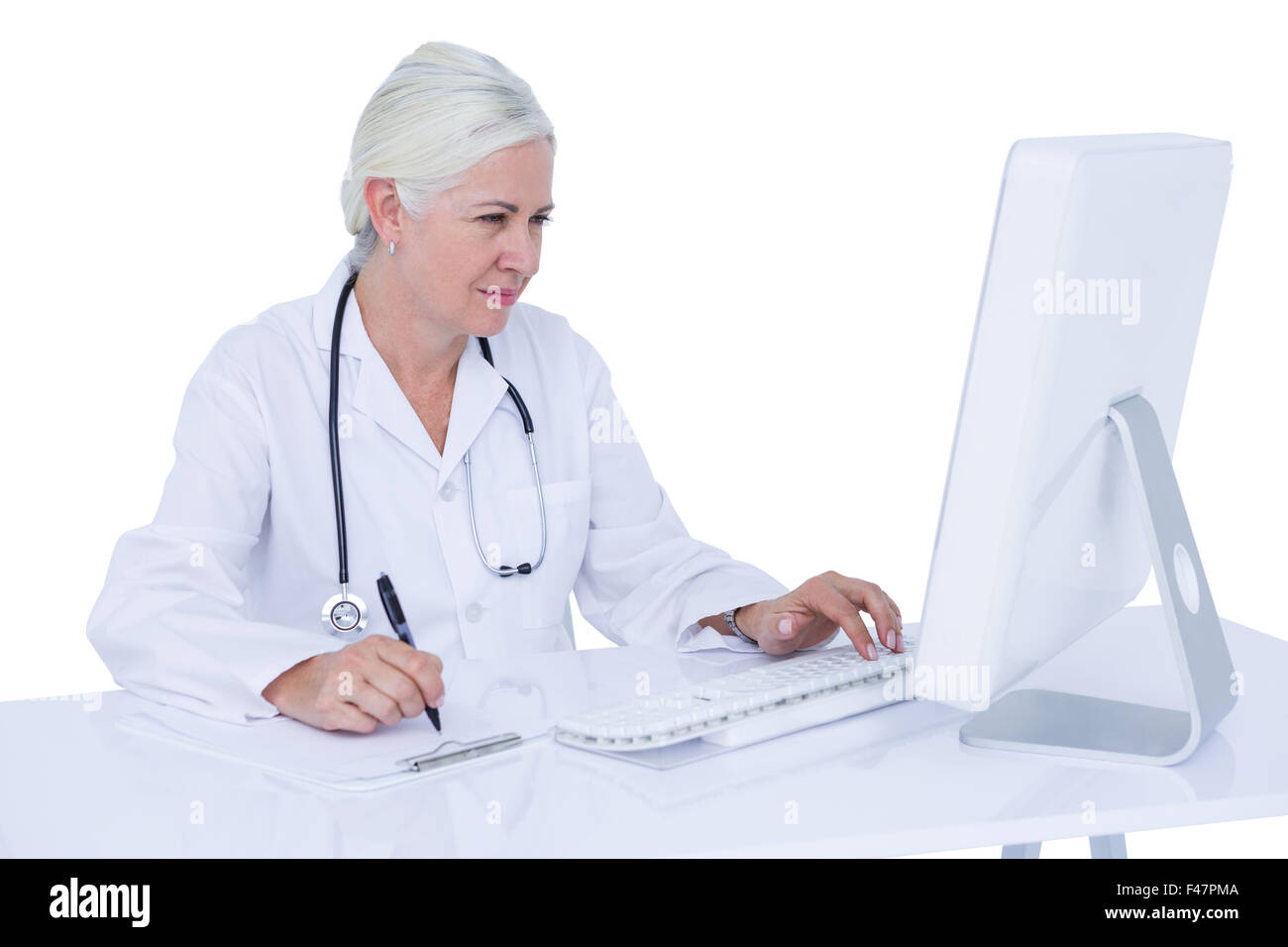 Doctor working on her computer Stock Photo - Alamy