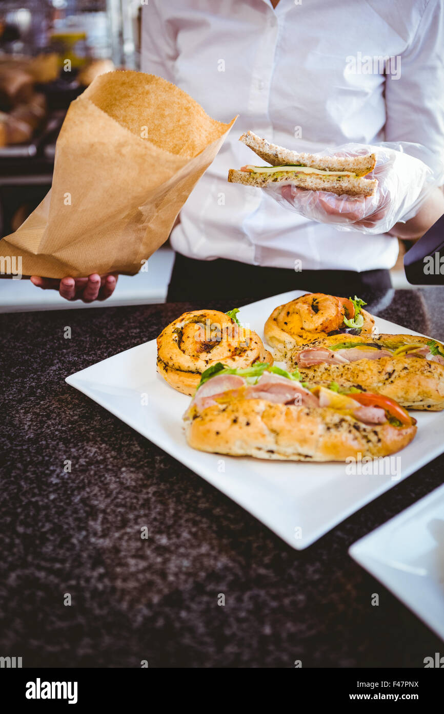 Barista preparing plate with sandwiches Stock Photo - Alamy