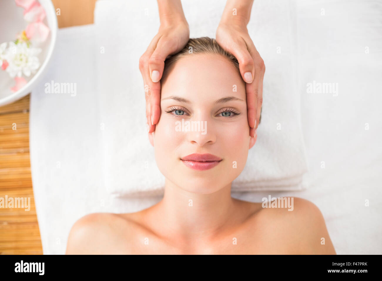 pretty blonde receiving head massage Stock Photo - Alamy