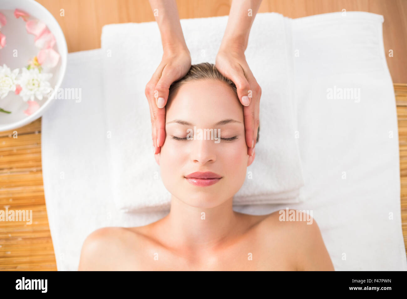 pretty blonde receiving head massage Stock Photo - Alamy