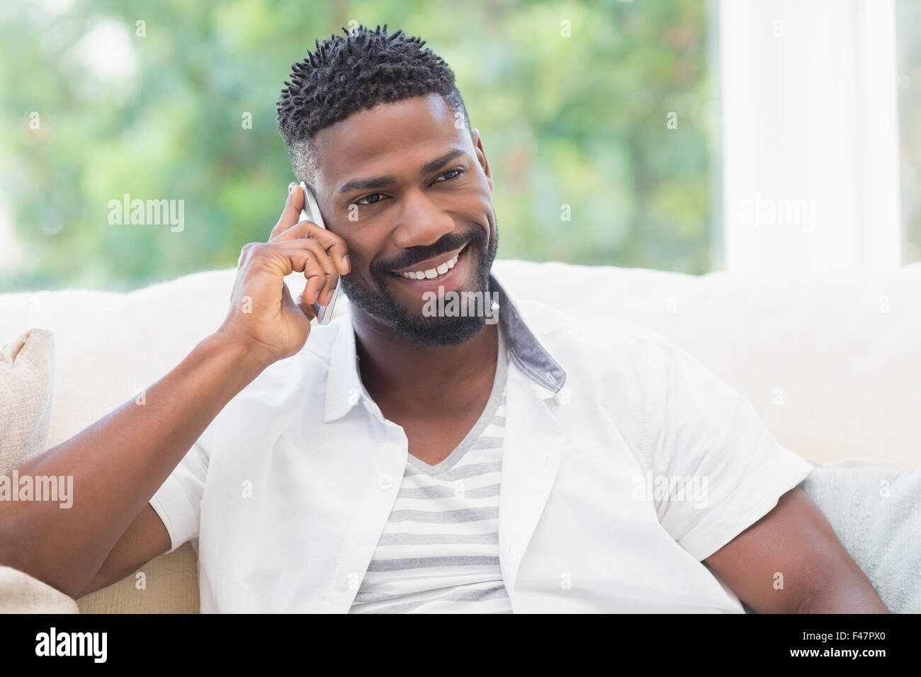 Happy man on the phone Stock Photo - Alamy