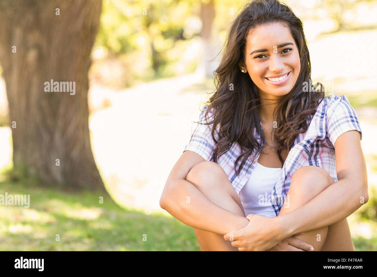 Stylish pretty brunette sitting hi-res stock photography and images - Alamy