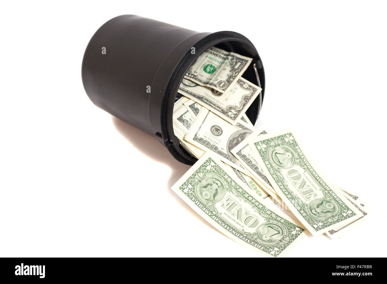 black plastic bucket filled with dollar bills isolated Stock Photo - Alamy