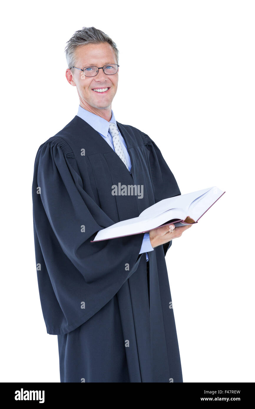 Happy handsome lawyer holding labor code Stock Photo - Alamy