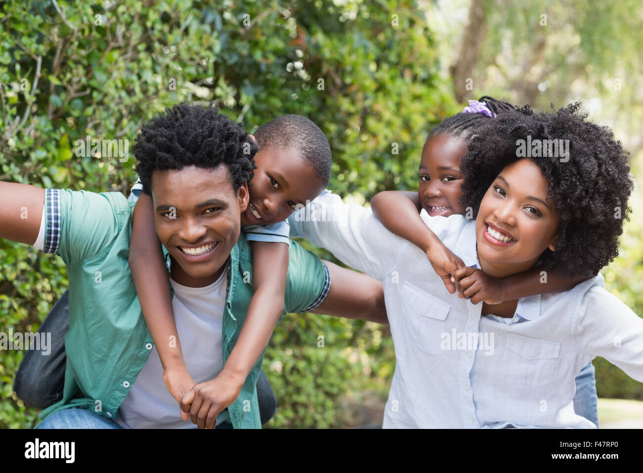 Happy family having fun together Stock Photo - Alamy