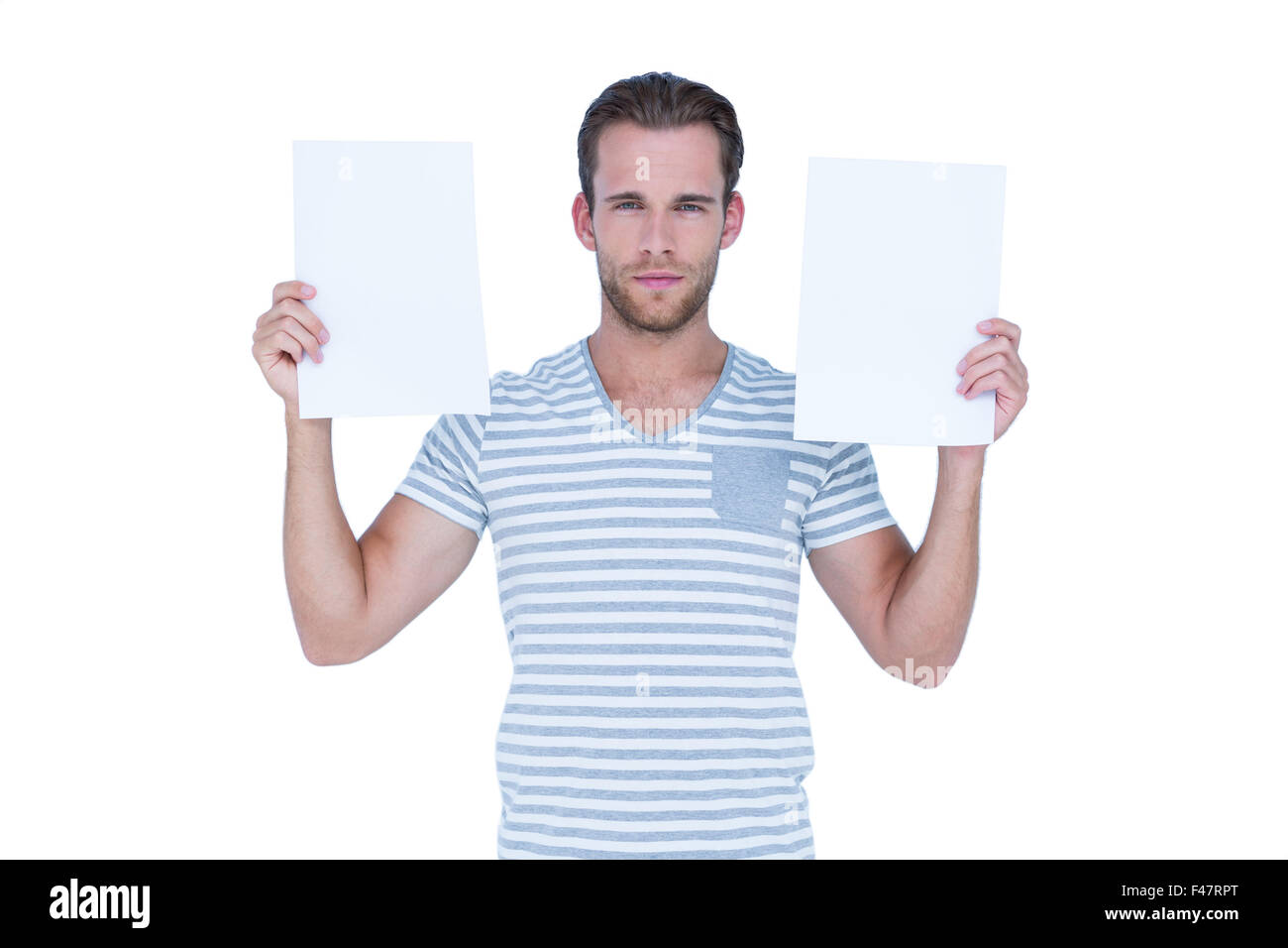 Serious handsome man holding papers Stock Photo - Alamy