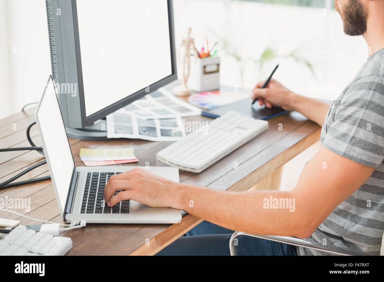 Graphic designer using a graphics tablet Stock Photo - Alamy