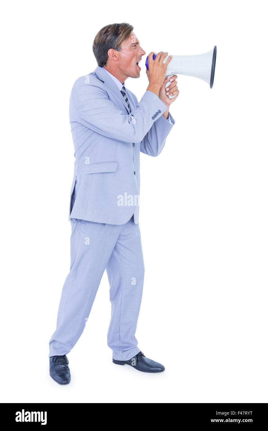 Businessman talking through megaphone Stock Photo - Alamy