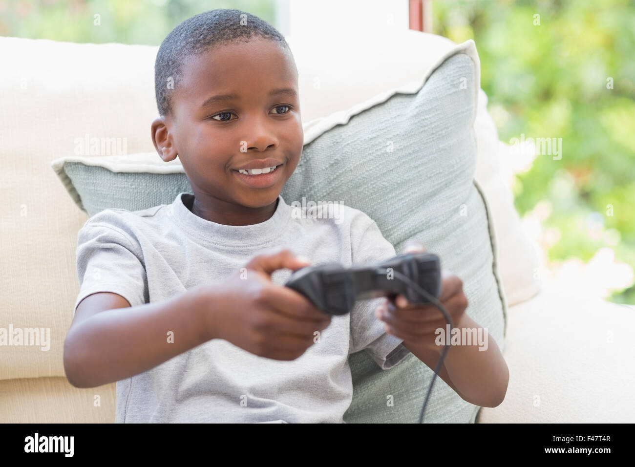 Little boy playing video games Stock Photo - Alamy