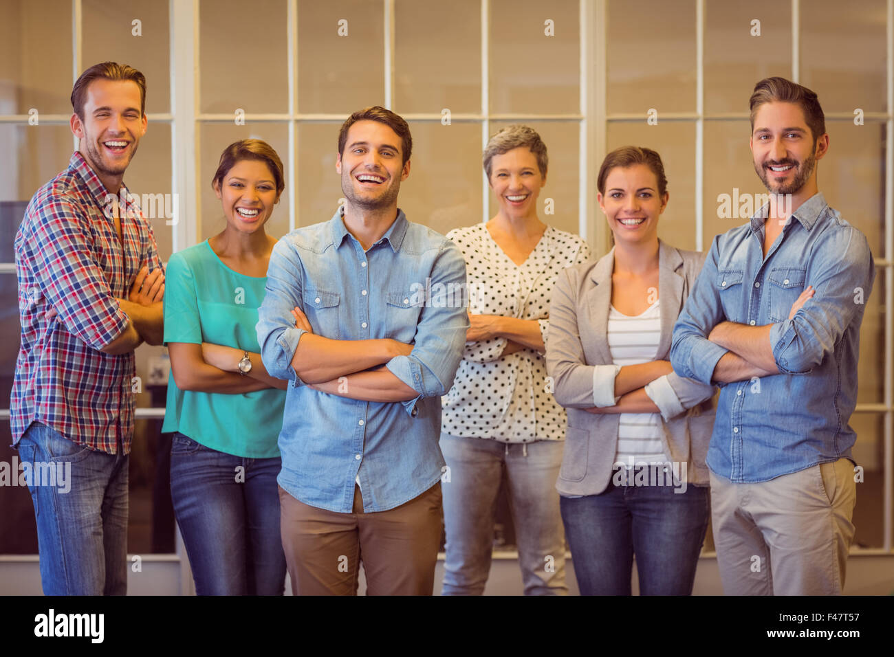 Creative business team looking at the camera Stock Photo - Alamy