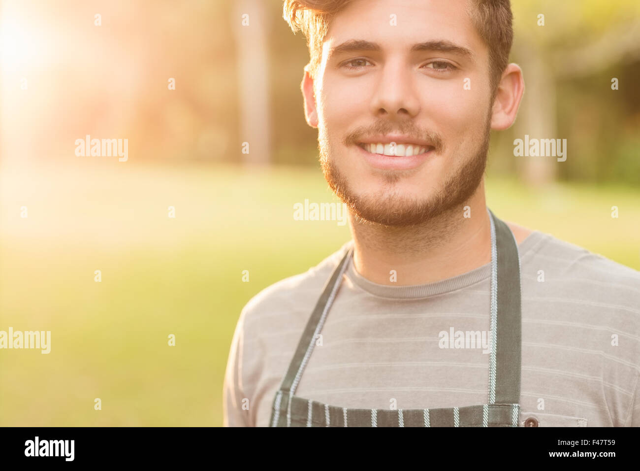 Handsome farmer smiling at camera Stock Photo - Alamy