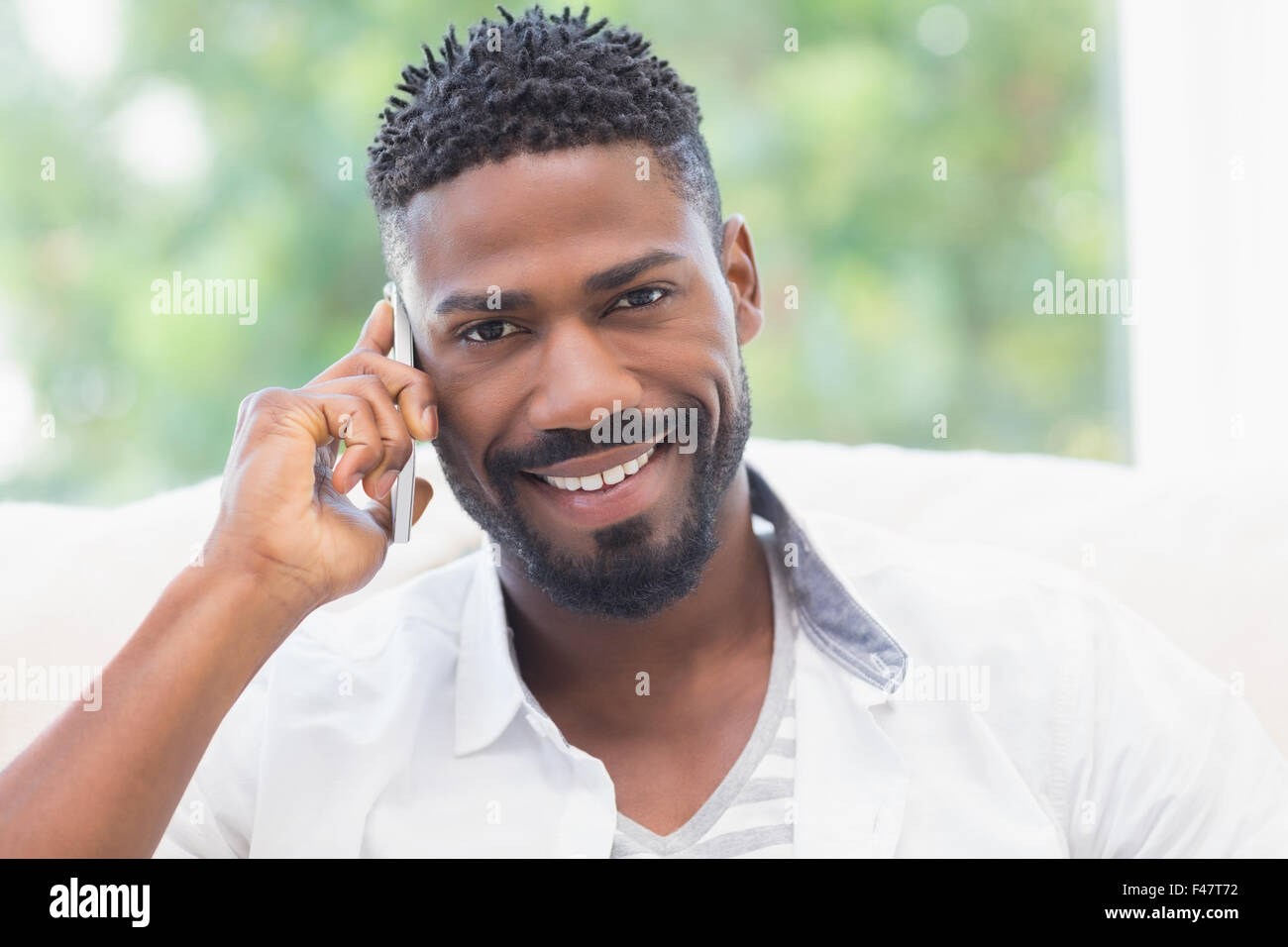 Happy man on the phone Stock Photo - Alamy