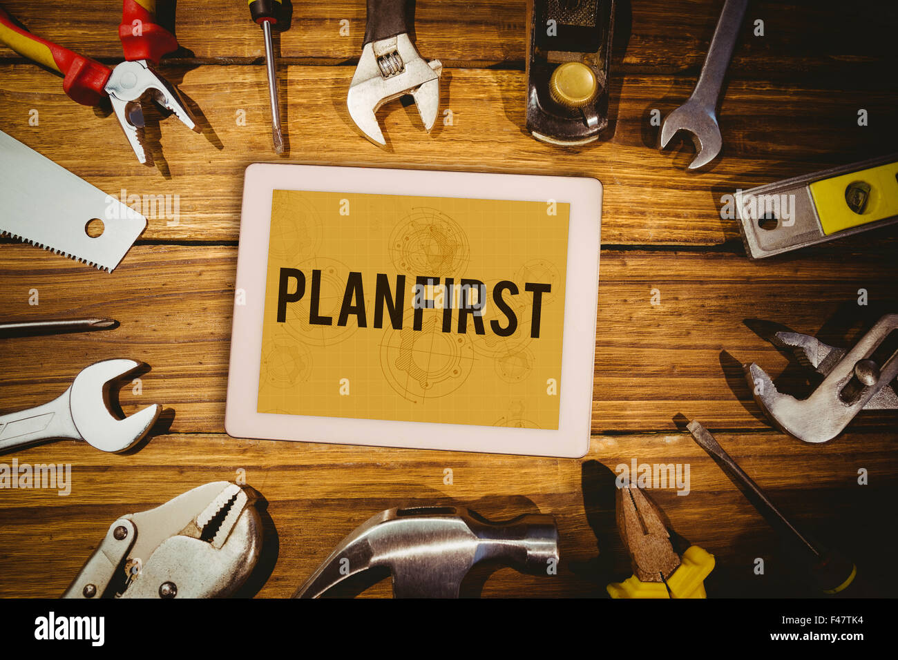 Plan first against architect background Stock Photo - Alamy