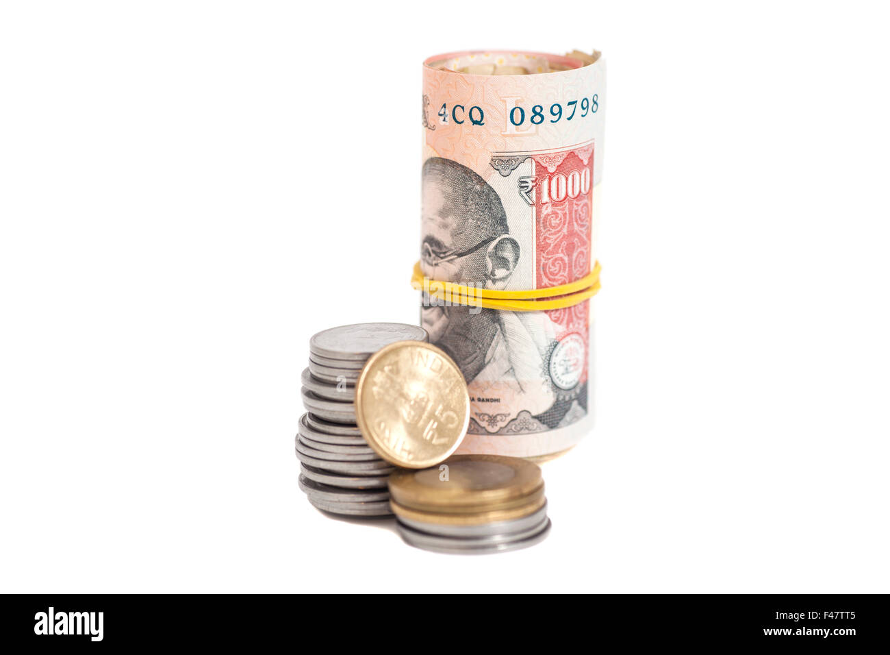 Roll of Indian Currency Rupees Notes and Coins Stock Photo - Alamy