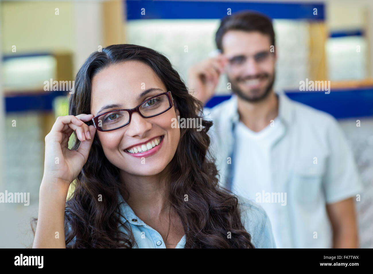 Two customers choosing glasses Stock Photo - Alamy