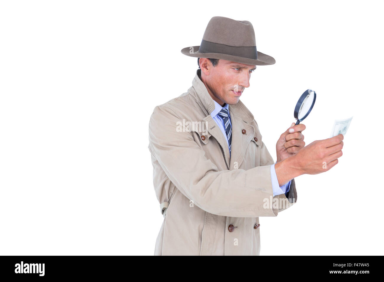 Spy looking through magnifier Stock Photo - Alamy
