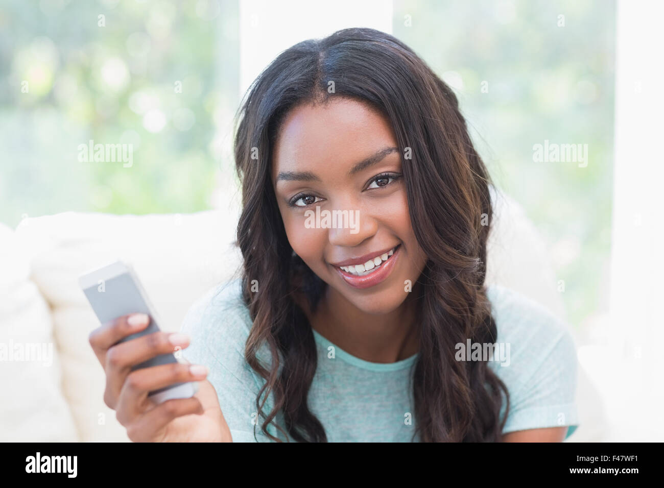 Happy woman on the phone Stock Photo - Alamy