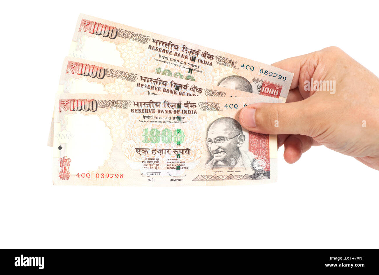 Hand with Indian thousand rupee notes isolated Stock Photo - Alamy