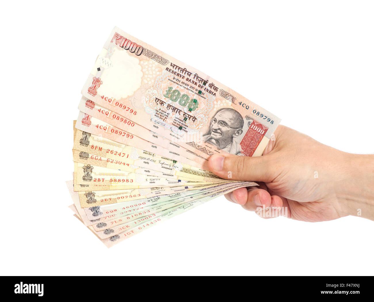 Hand with Indian thousand rupee notes isolated Stock Photo - Alamy