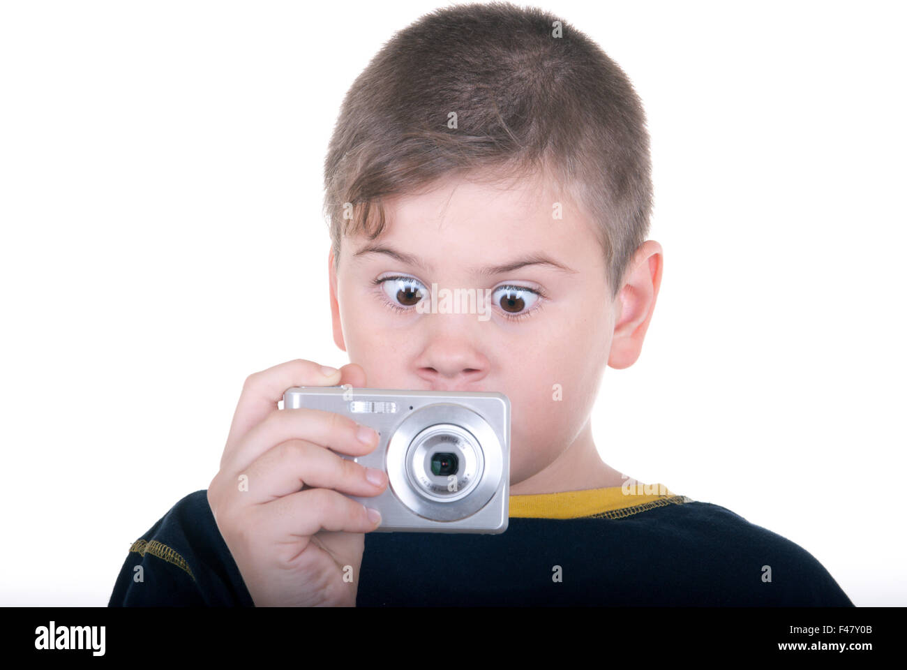 Surprised boy with camera Stock Photo - Alamy