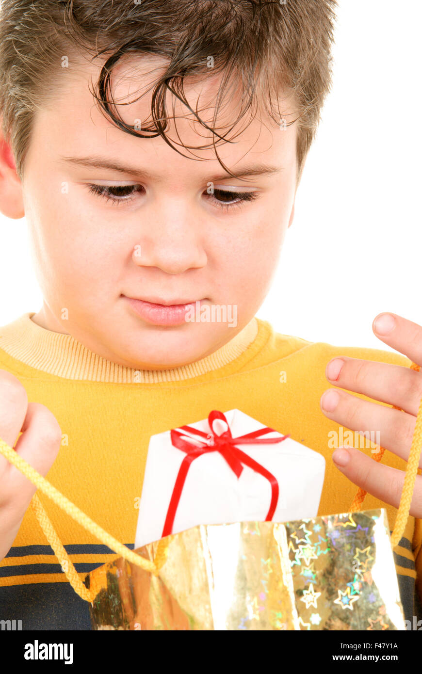 Boy holds package with gifts Stock Photo - Alamy