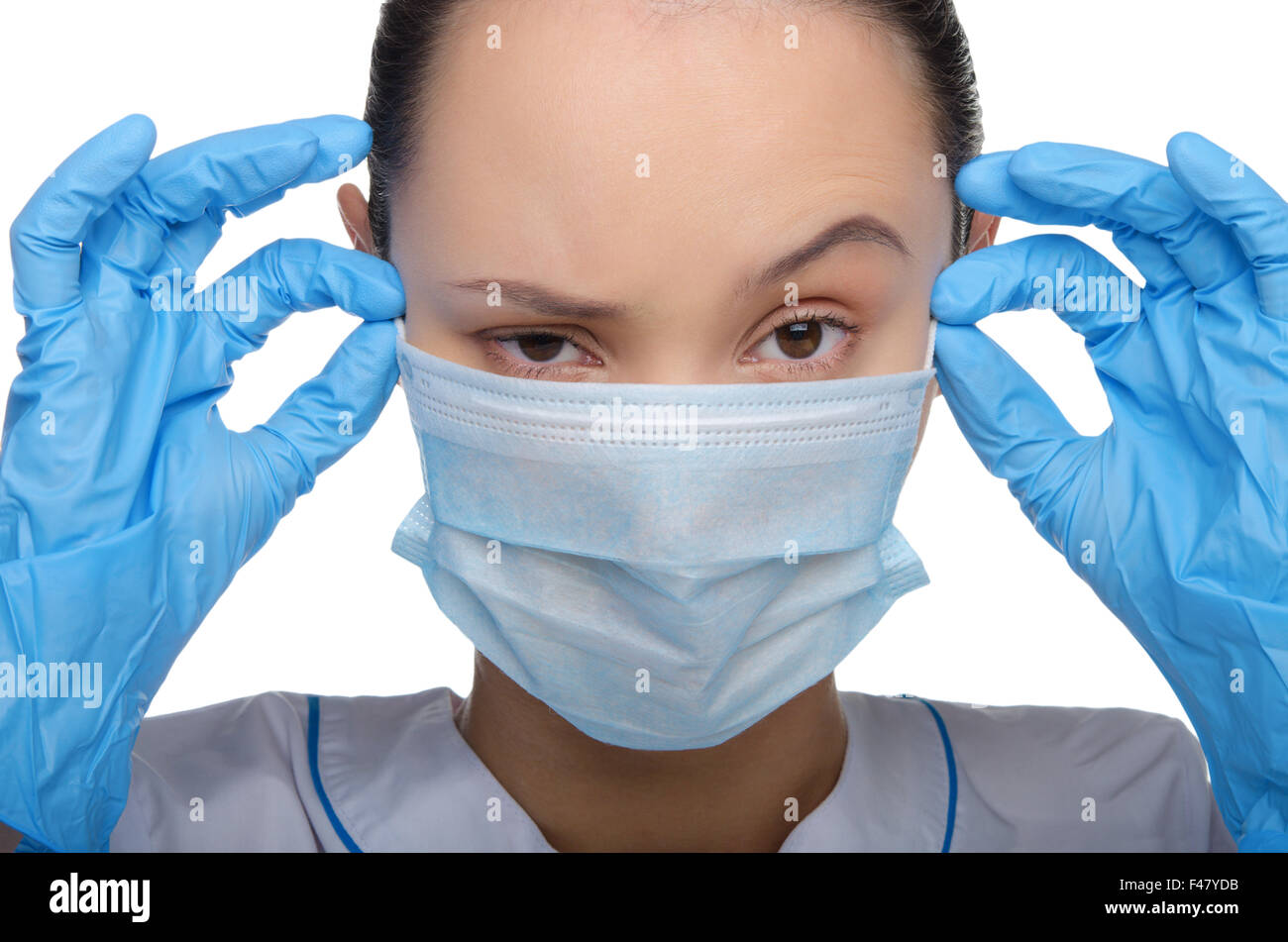 Young doctor wearing a mask and gloves Stock Photo - Alamy