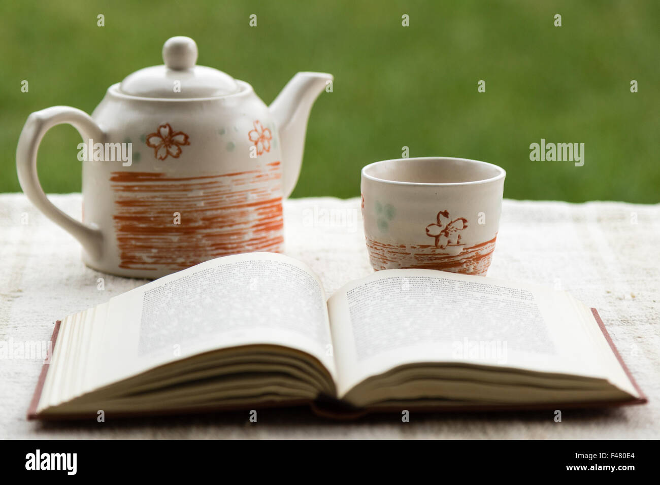 tea and book Stock Photo - Alamy