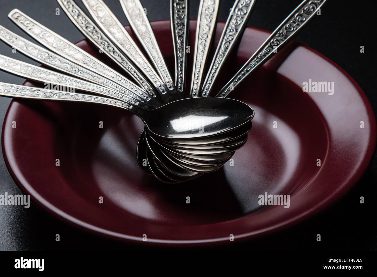 spoons in a plate Stock Photo - Alamy