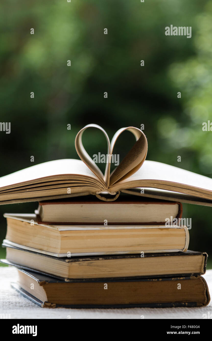 stack of books with heart shape Stock Photo - Alamy