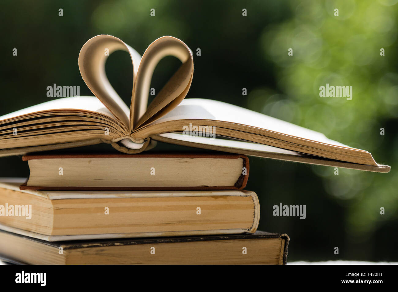 stack of books with heart shape Stock Photo - Alamy