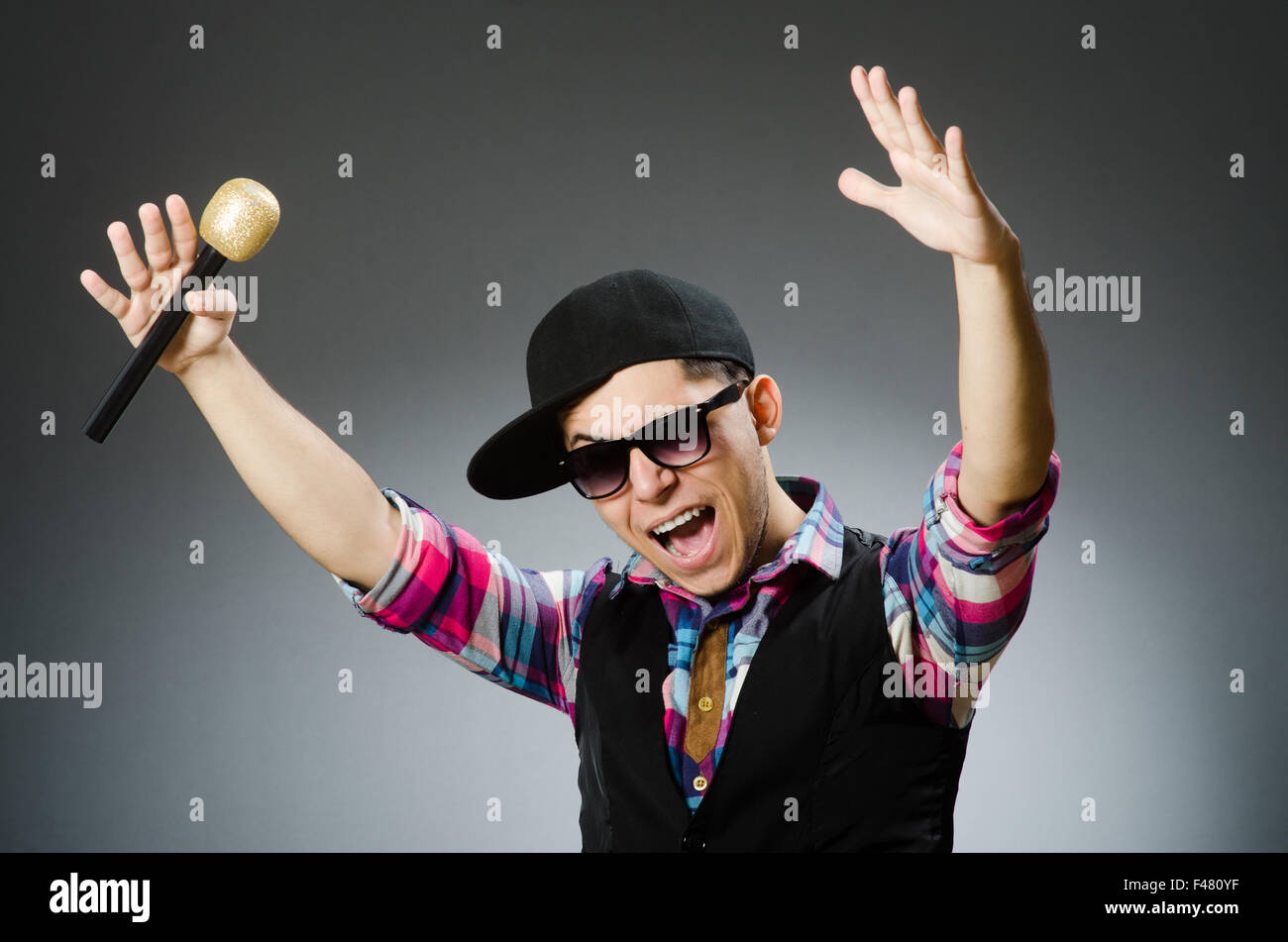 Funny man singing in karaoke Stock Photo - Alamy