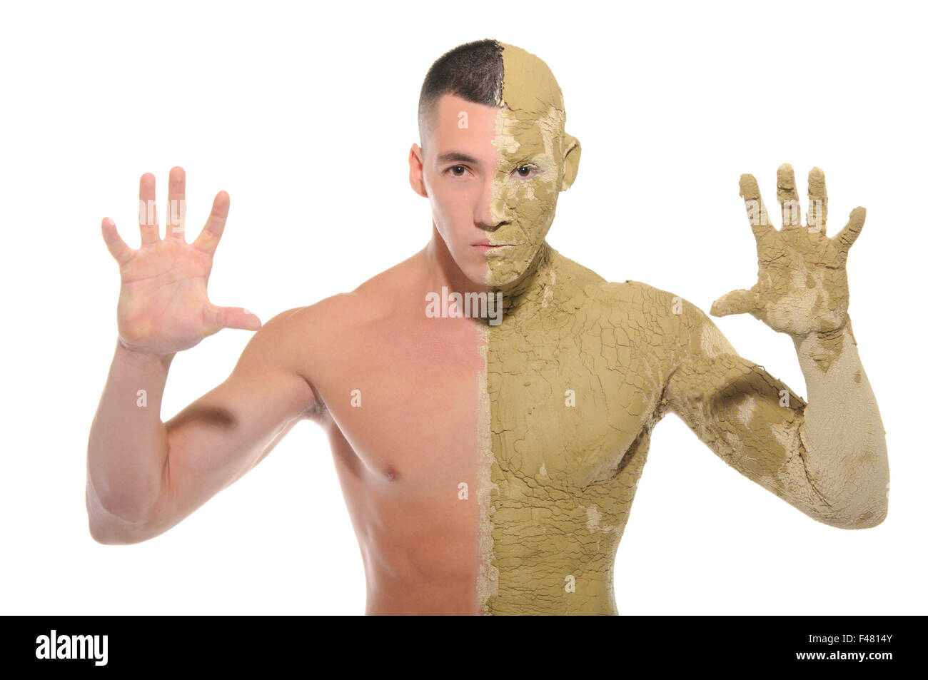young man half smeared with clay Stock Photo - Alamy