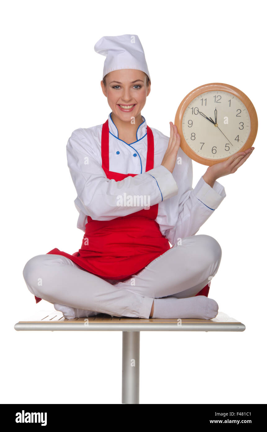 Smiling chef holding a clock Stock Photo - Alamy