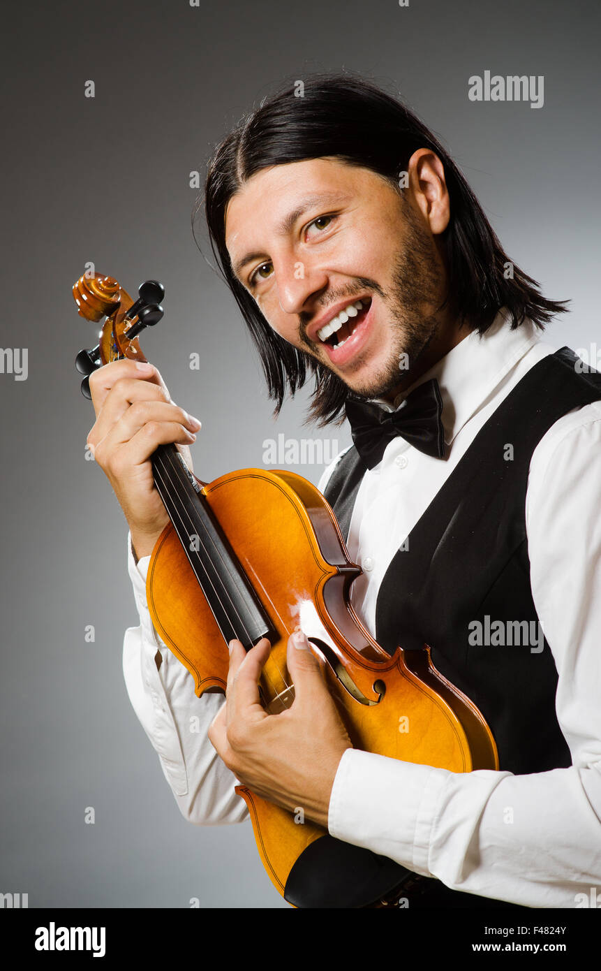Man playing violin in musical concept Stock Photo - Alamy