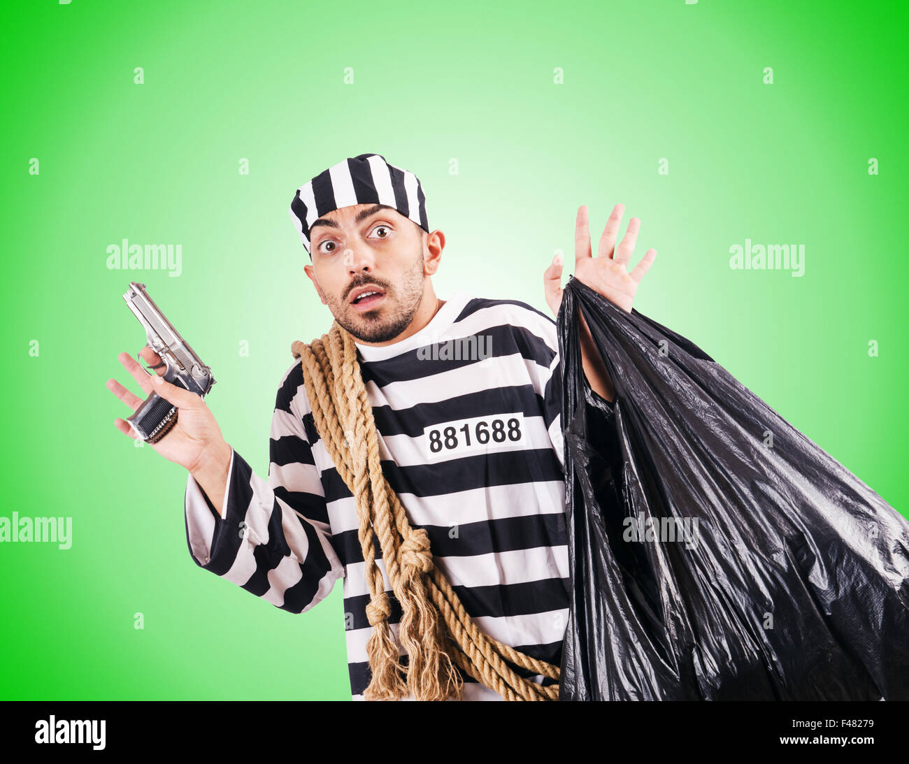 Convict criminal in striped uniform Stock Photo - Alamy
