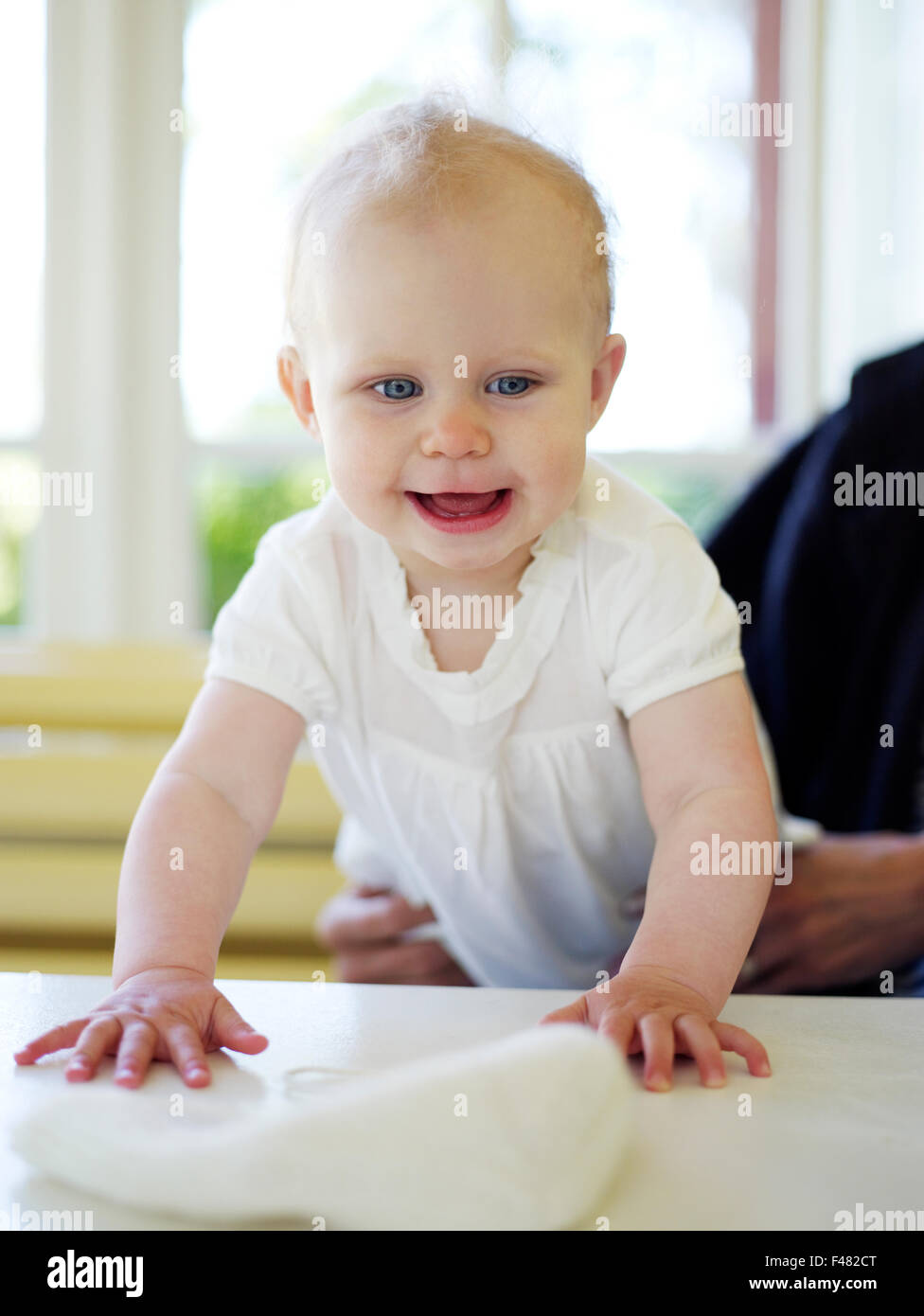Happy girl leaning forward hi-res stock photography and images - Alamy