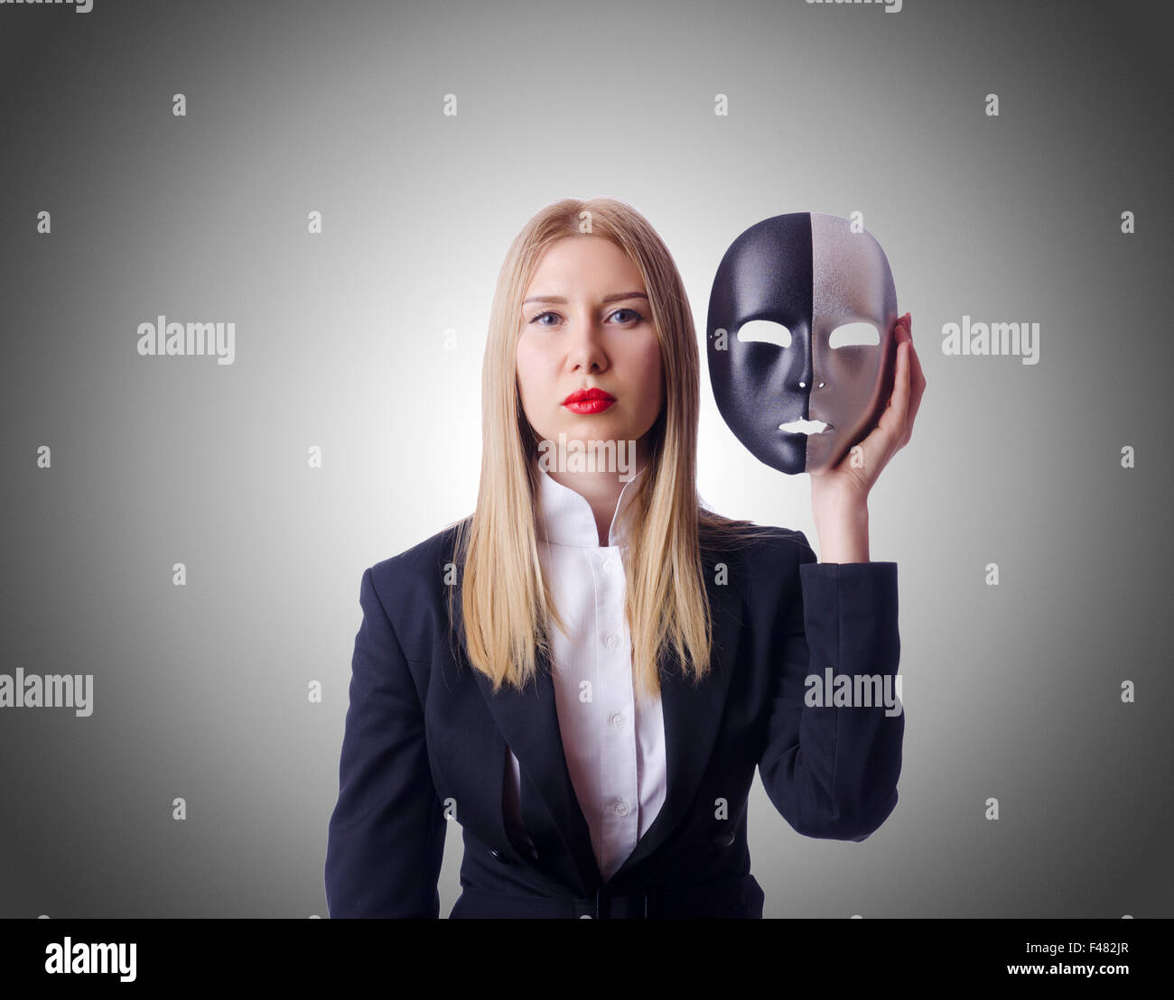 Woman with mask in hypocrisy concept Stock Photo - Alamy