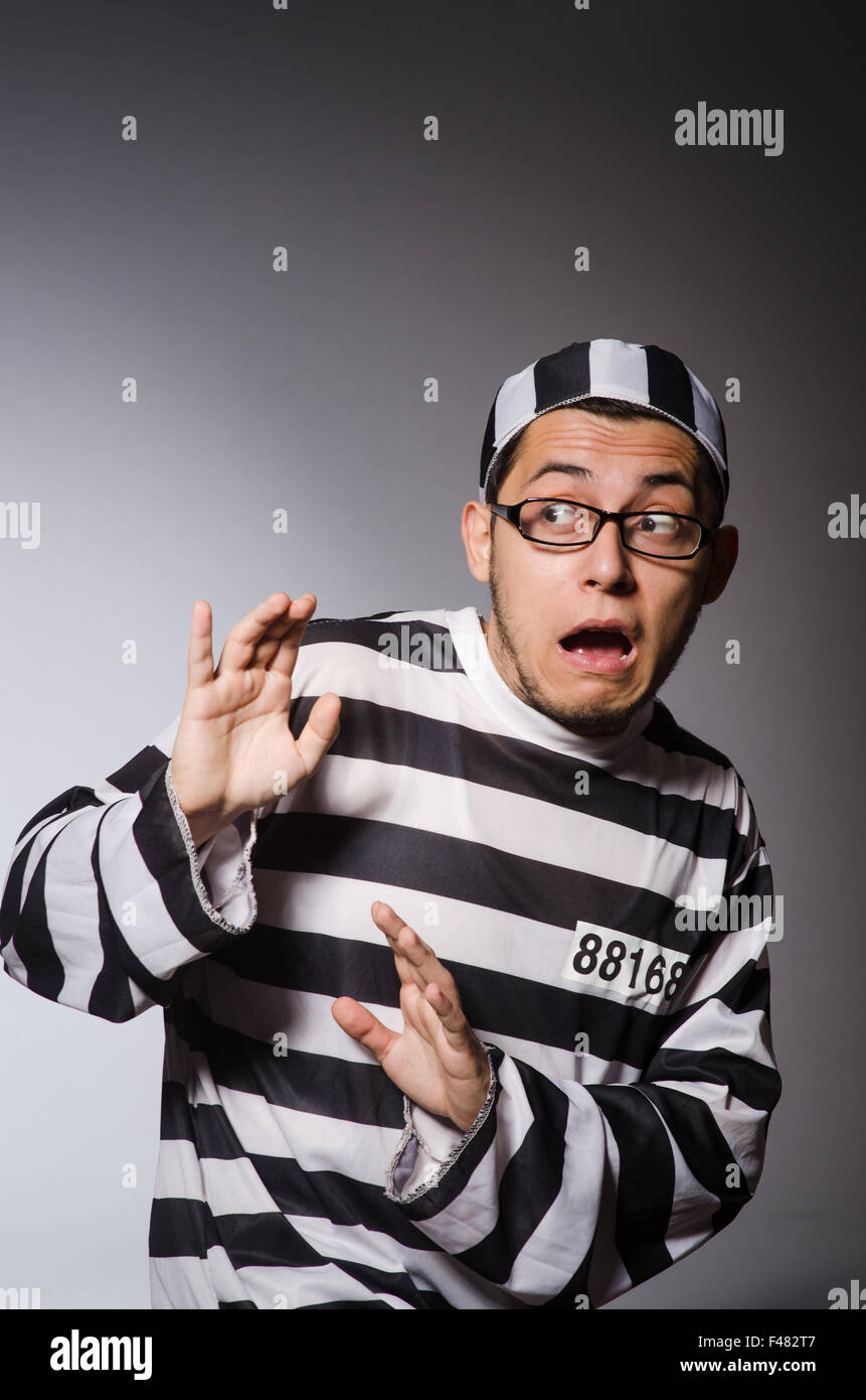 Funny prisoner isolated on gray Stock Photo - Alamy