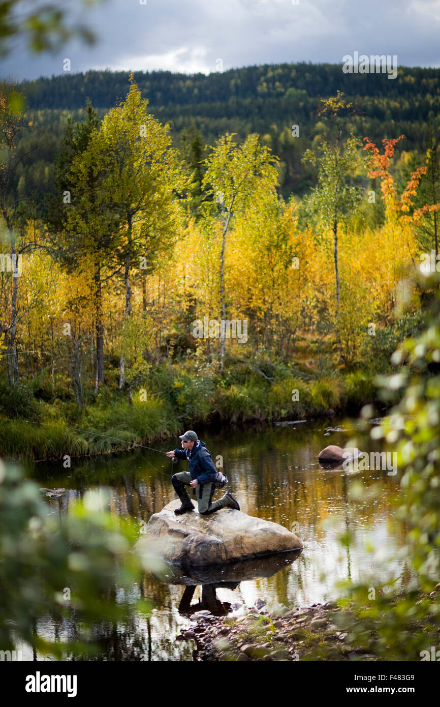 A man fly-fishing, Sweden Stock Photo - Alamy