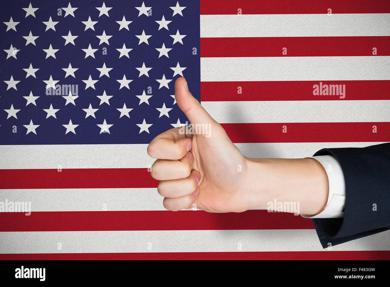 Composite image of hand showing thumbs up Stock Photo - Alamy