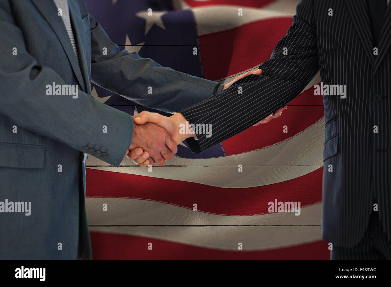 Composite image of handshake in agreement Stock Photo - Alamy