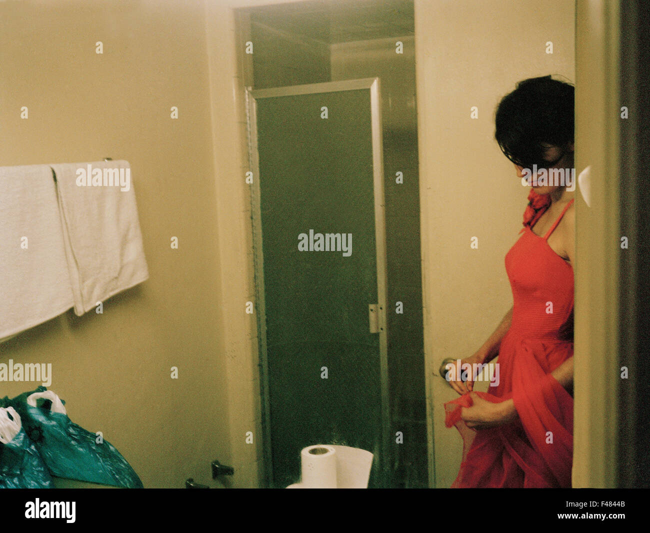 A woman in a motel Stock Photo - Alamy