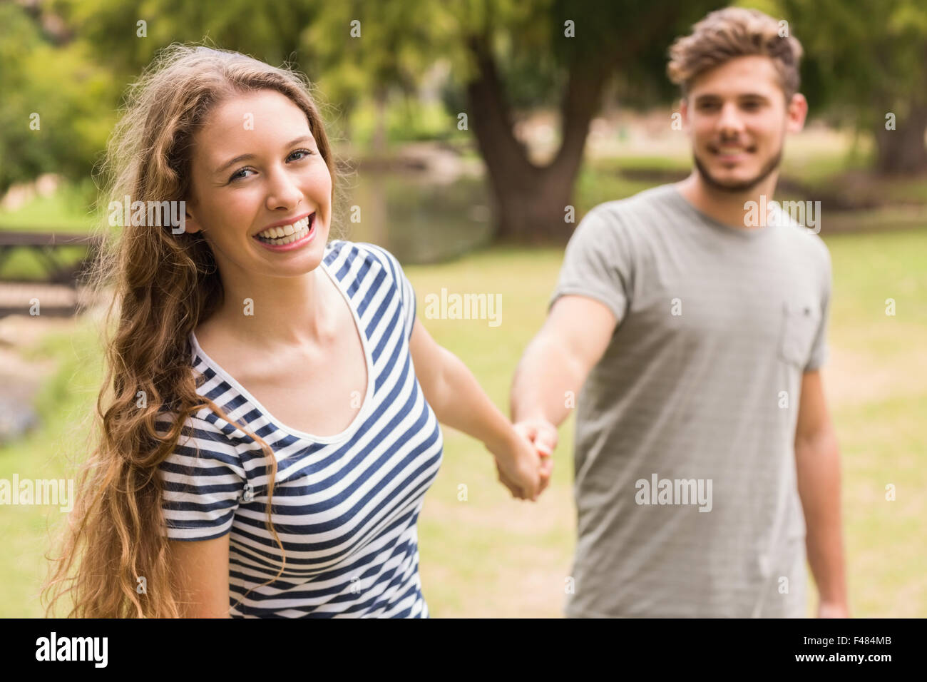 Cute couple strolling in the park Stock Photo - Alamy
