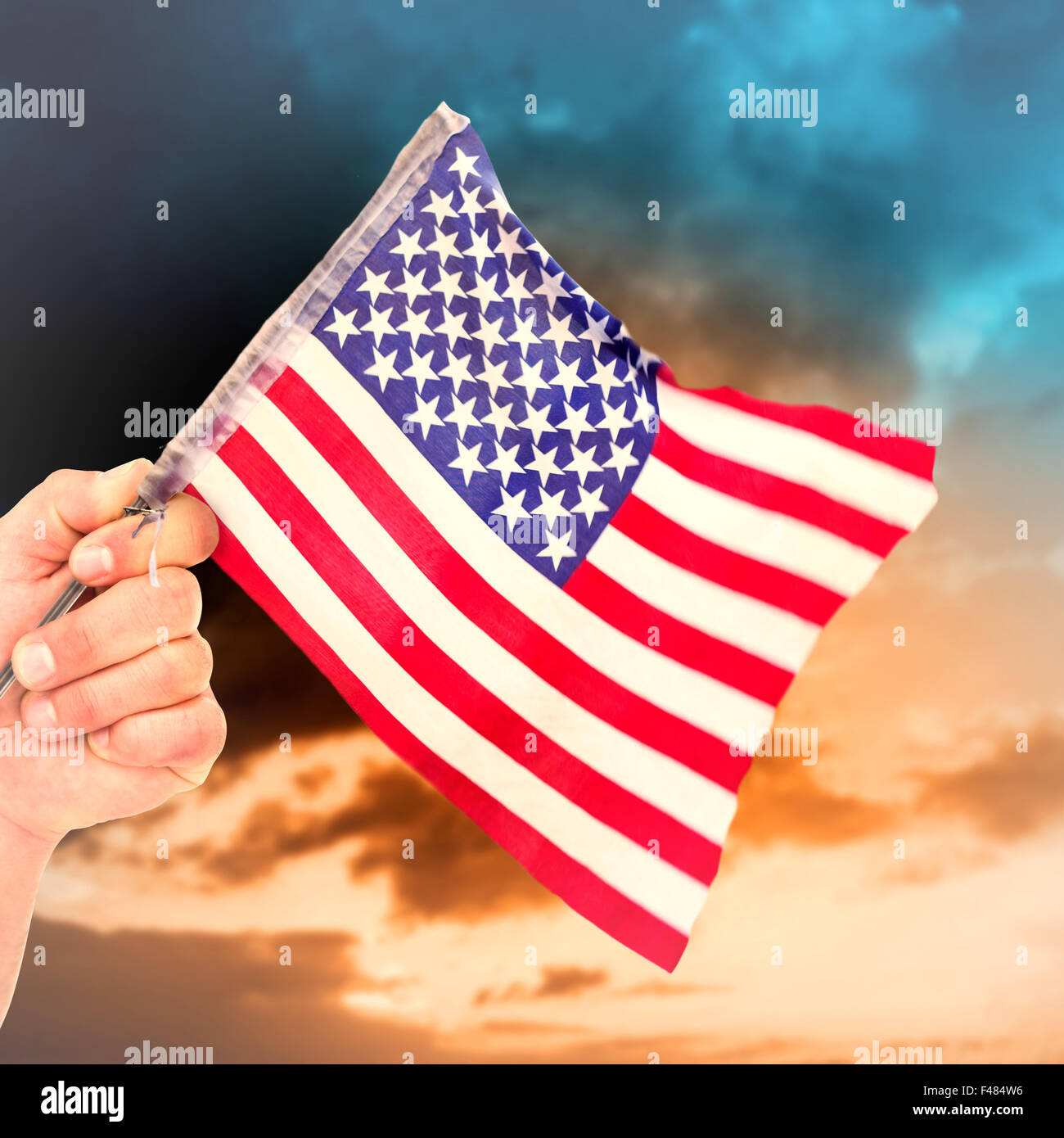 Composite image of hand waving american flag Stock Photo - Alamy
