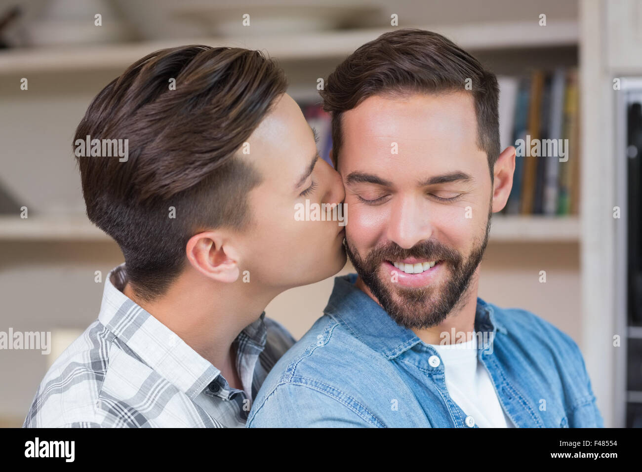 Handsome man embracing his boyfriend Stock Photo - Alamy