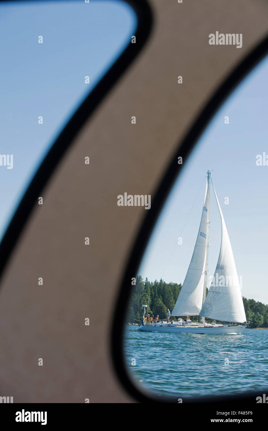 Sailing-boat seen through the window of a motorboat, Sweden Stock Photo ...